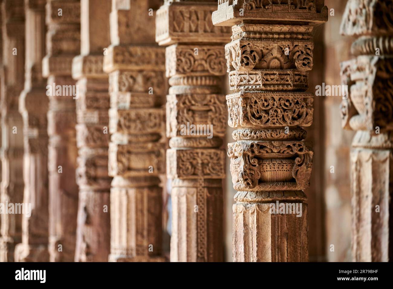 Stone columns with decorative bas relief of Qutb complex in South Delhi ...