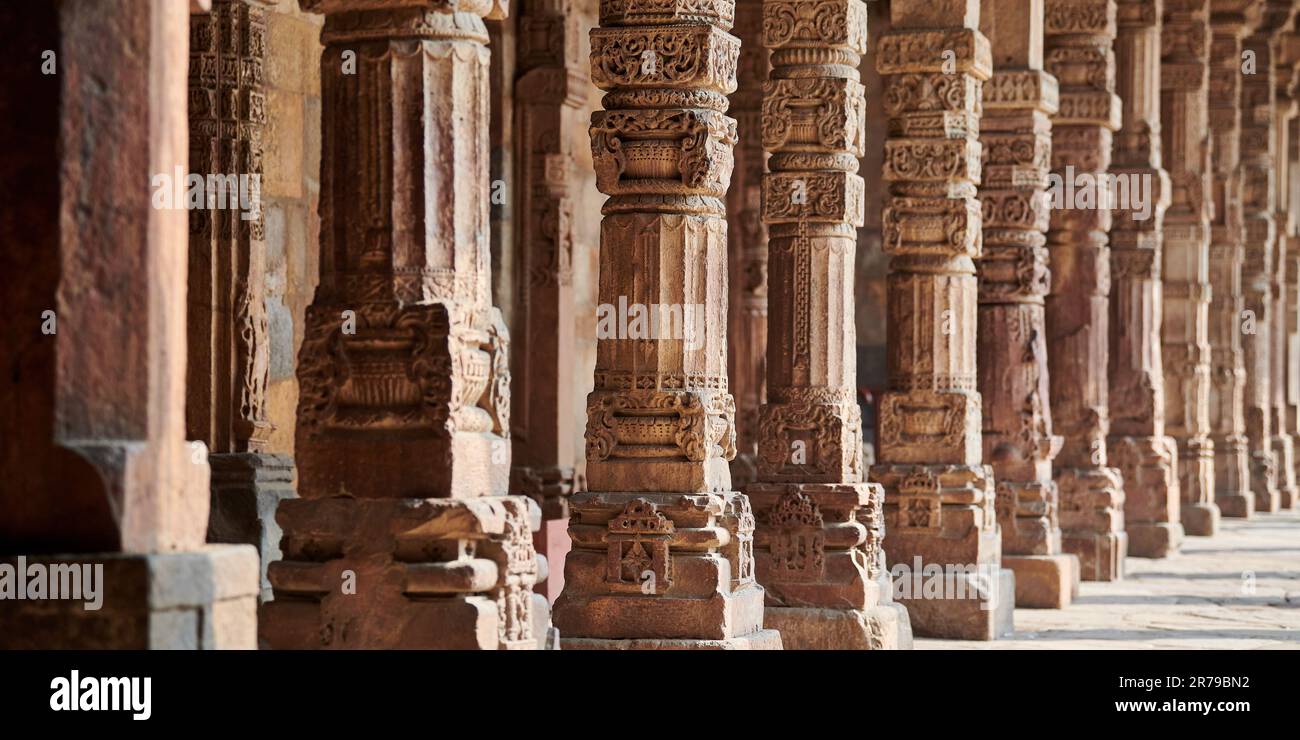 Stone columns with decorative bas relief of Qutb complex in South Delhi ...