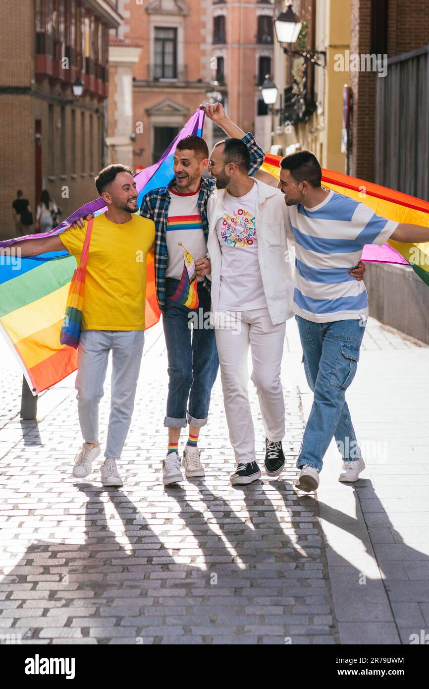 Radiant Friendship: Four Gay Men Embrace, Smile, and Flaunt LGBT Pride ...
