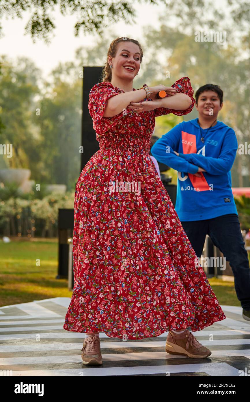 New Delhi, India - 10.12.2022 - Children entertainer in red dress dance ...