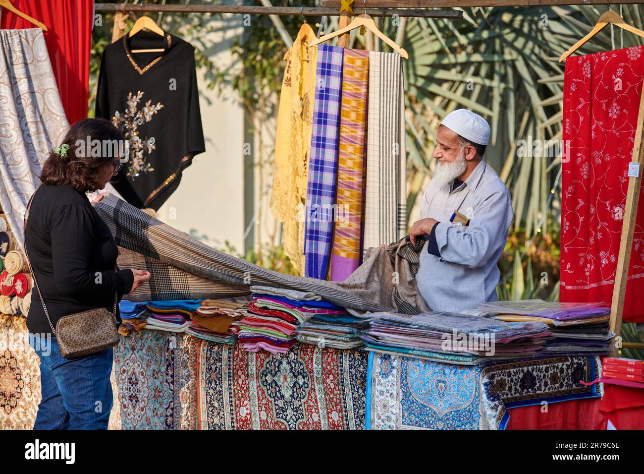 New Delhi, India - 10.12.2022 - Old seller of textile and carpet shows ...