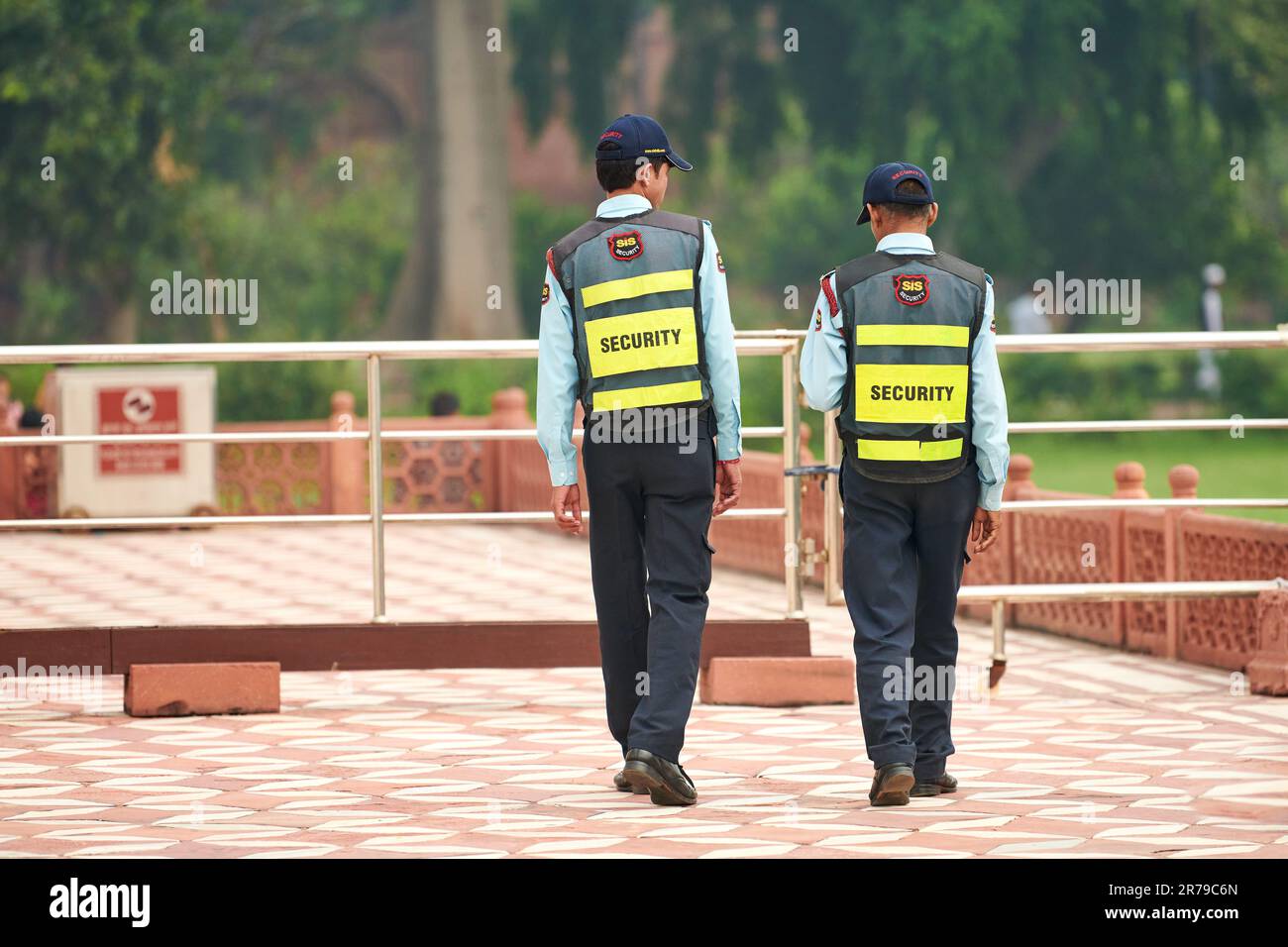 Agra, India - 09.11.2022 - Back view of two indian security guards in ...