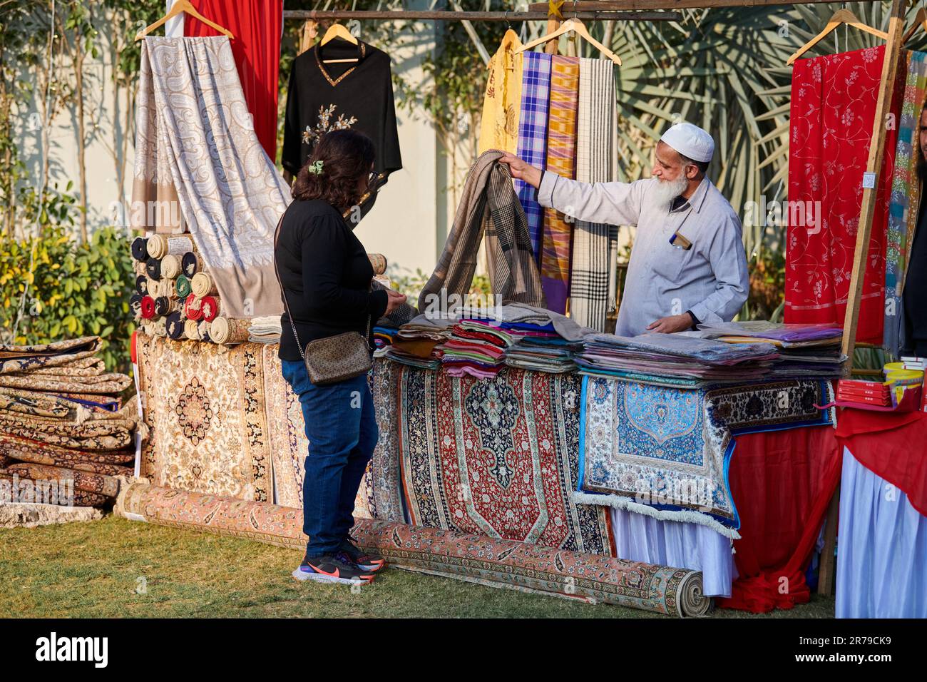 New Delhi, India - 10.12.2022 - Old seller of textile and carpet shows ...