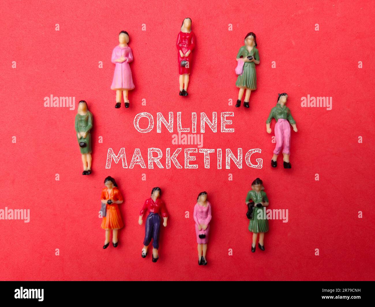 A group of small figurines posed in a circle formation with words ...