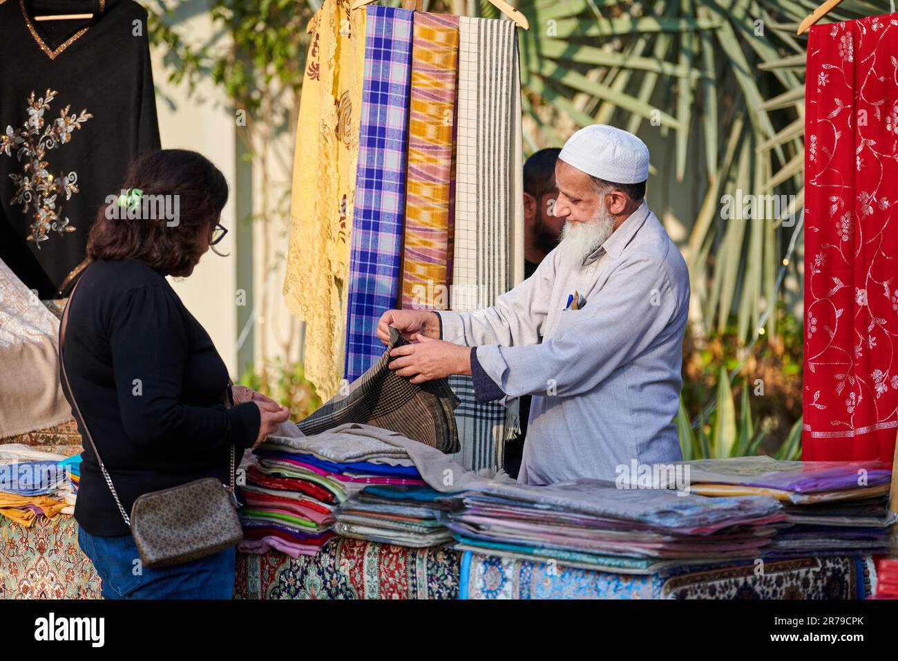 New Delhi, India - 10.12.2022 - Old seller of textile and carpet shows ...