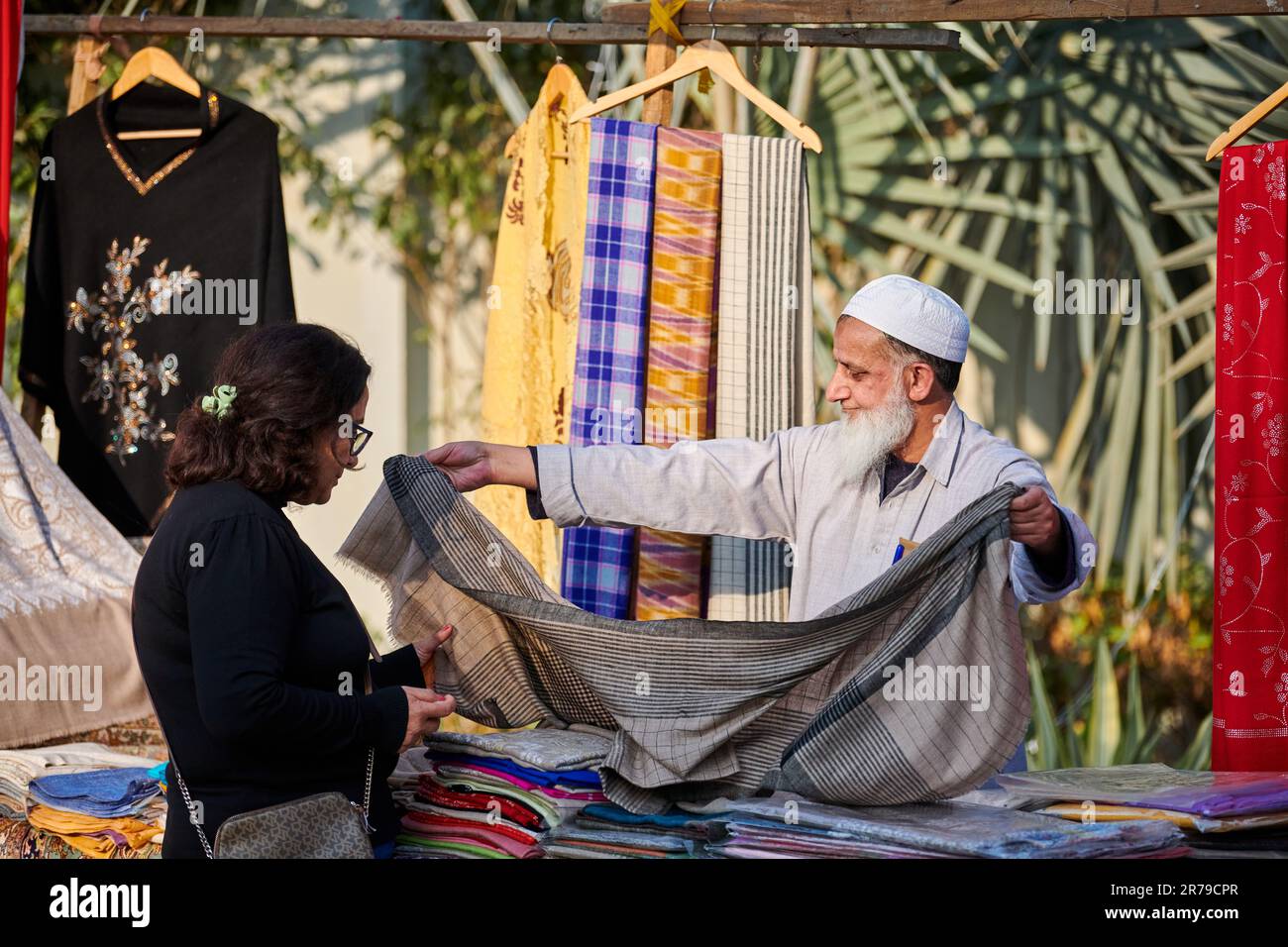 New Delhi, India - 10.12.2022 - Old seller of textile and carpet shows ...