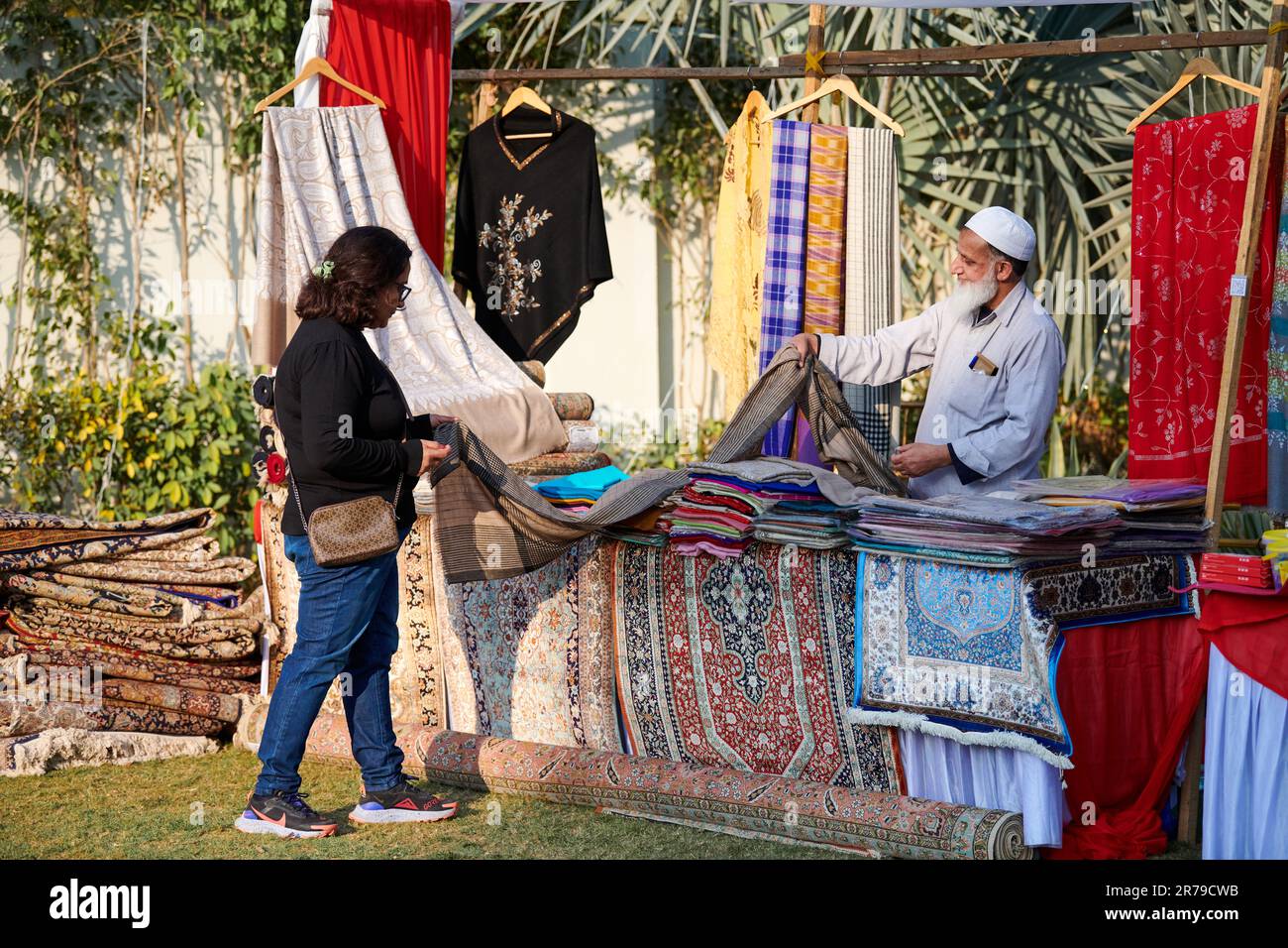 New Delhi, India - 10.12.2022 - Old seller of textile and carpet shows ...