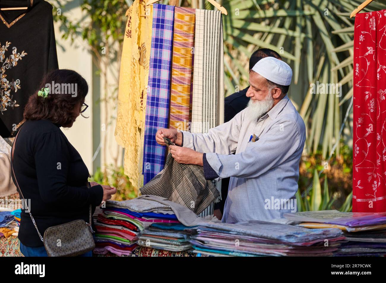 New Delhi, India - 10.12.2022 - Old seller of textile and carpet shows ...