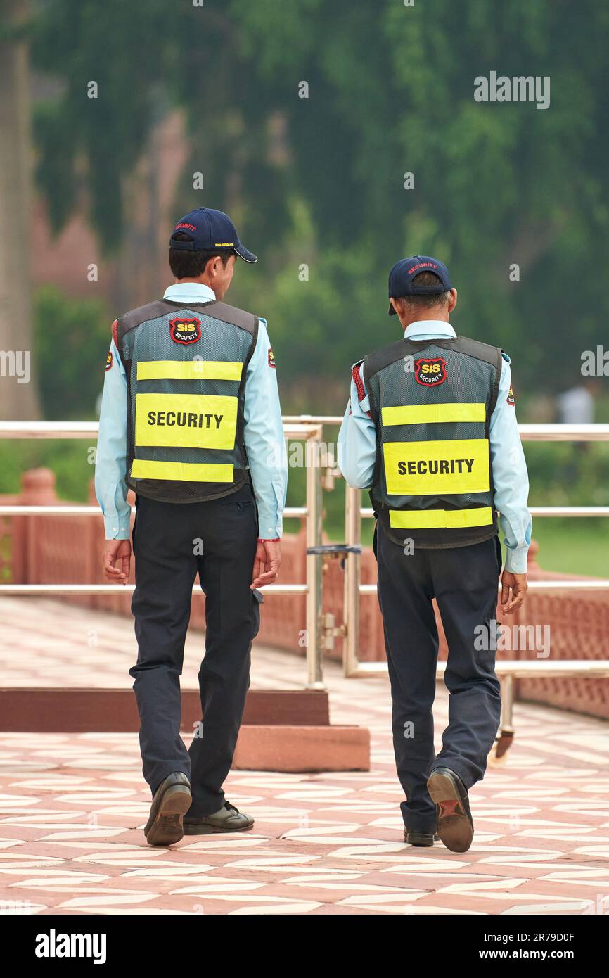 Agra, India - 09.11.2022 - Back view of two indian security guards in ...