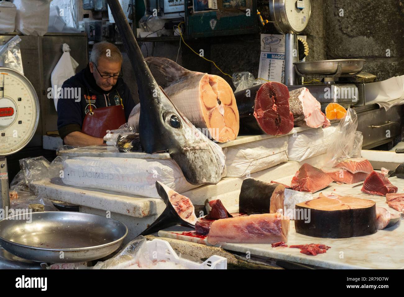 Men at work shop keepers stall owners in open air fresh fish meat ...