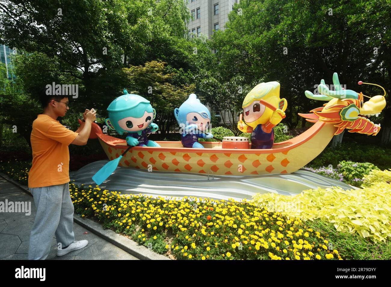 HANGZHOU, CHINA - JUNE 14, 2023 - A citizen takes photos of the mascot ...