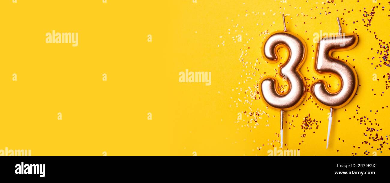 35 years celebration. Greeting banner. Gold candles in the form of ...