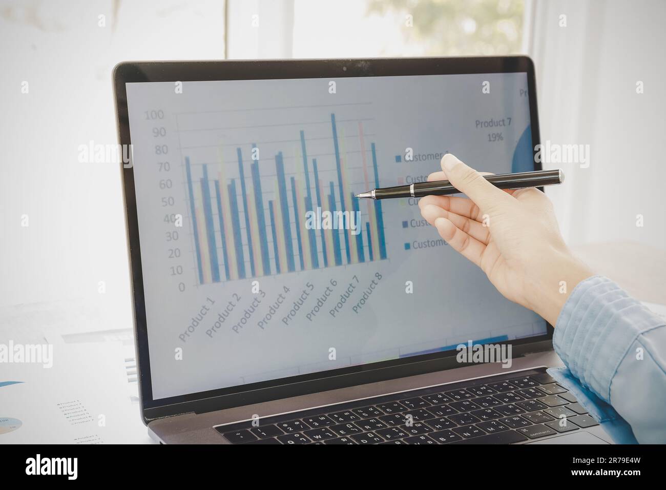 Businesswoman looking at laptop screen, spreadsheets, graph financial ...
