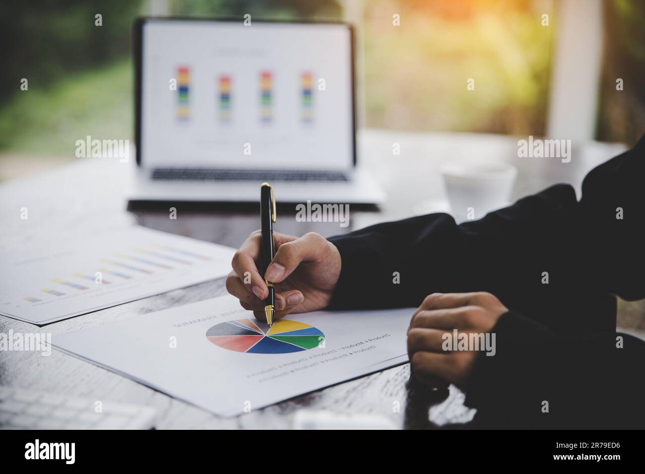 Businessman looking at charts, spreadsheets, graph financial ...