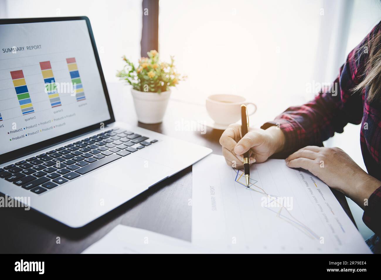 Businesswoman looking at charts, spreadsheets, graph financial ...