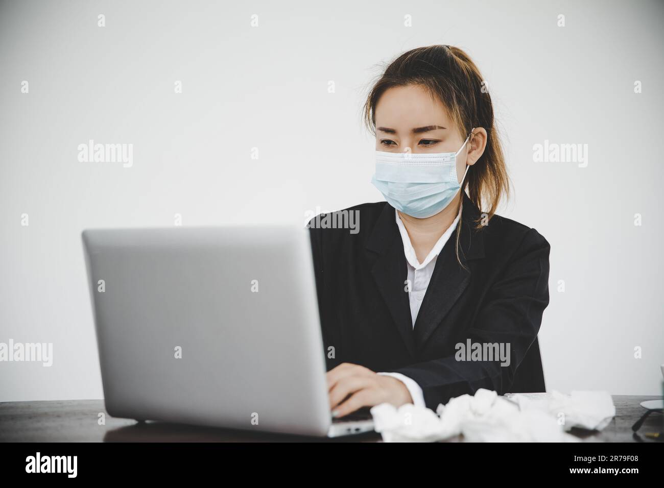Sick young asian business woman wearing protective face mask having ... Sick young asian business woman wearing protective face mask having ...