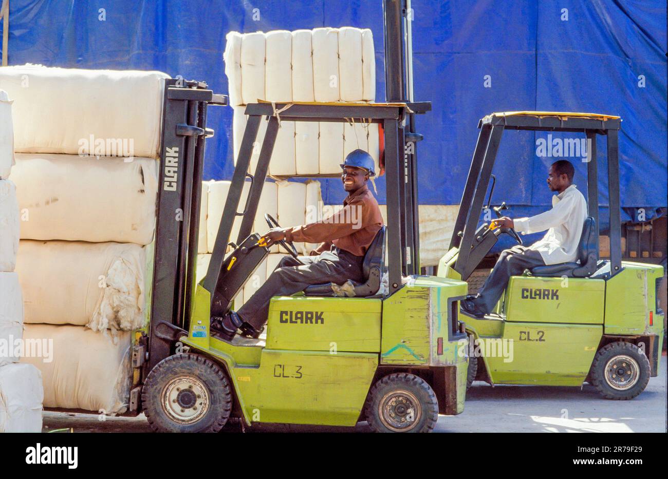 Zambia, Ndola, labourers of Swarp Spinning Mills transport cotton to ...