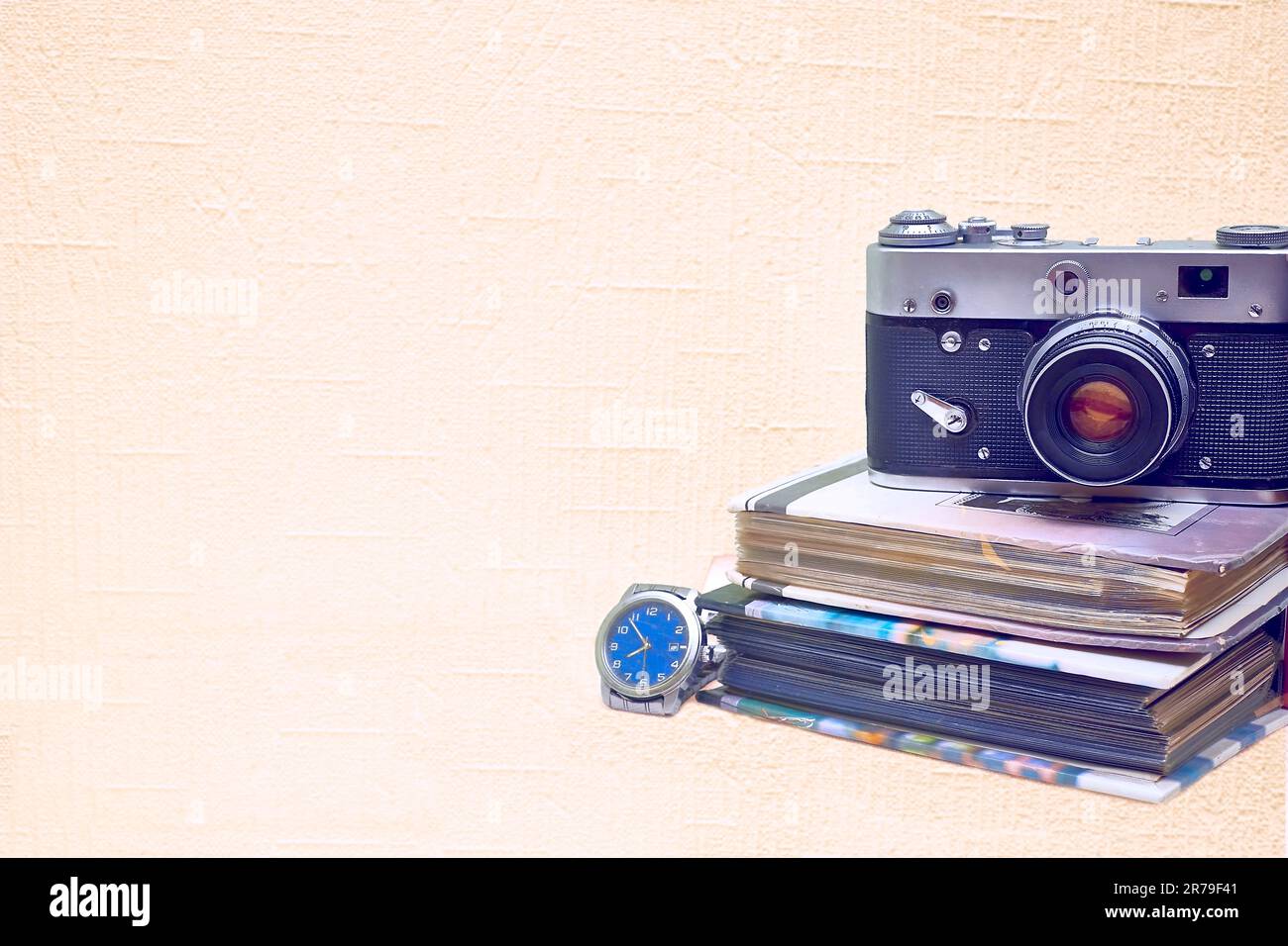 Old vintage film photo camera with photo album and watch isolated on ...