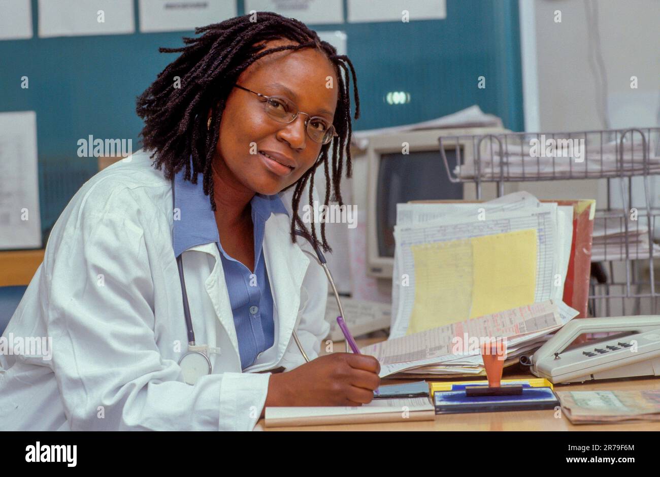 Zimbabwe, Harare. nurse in a hospital is busy keeping records Stock ...