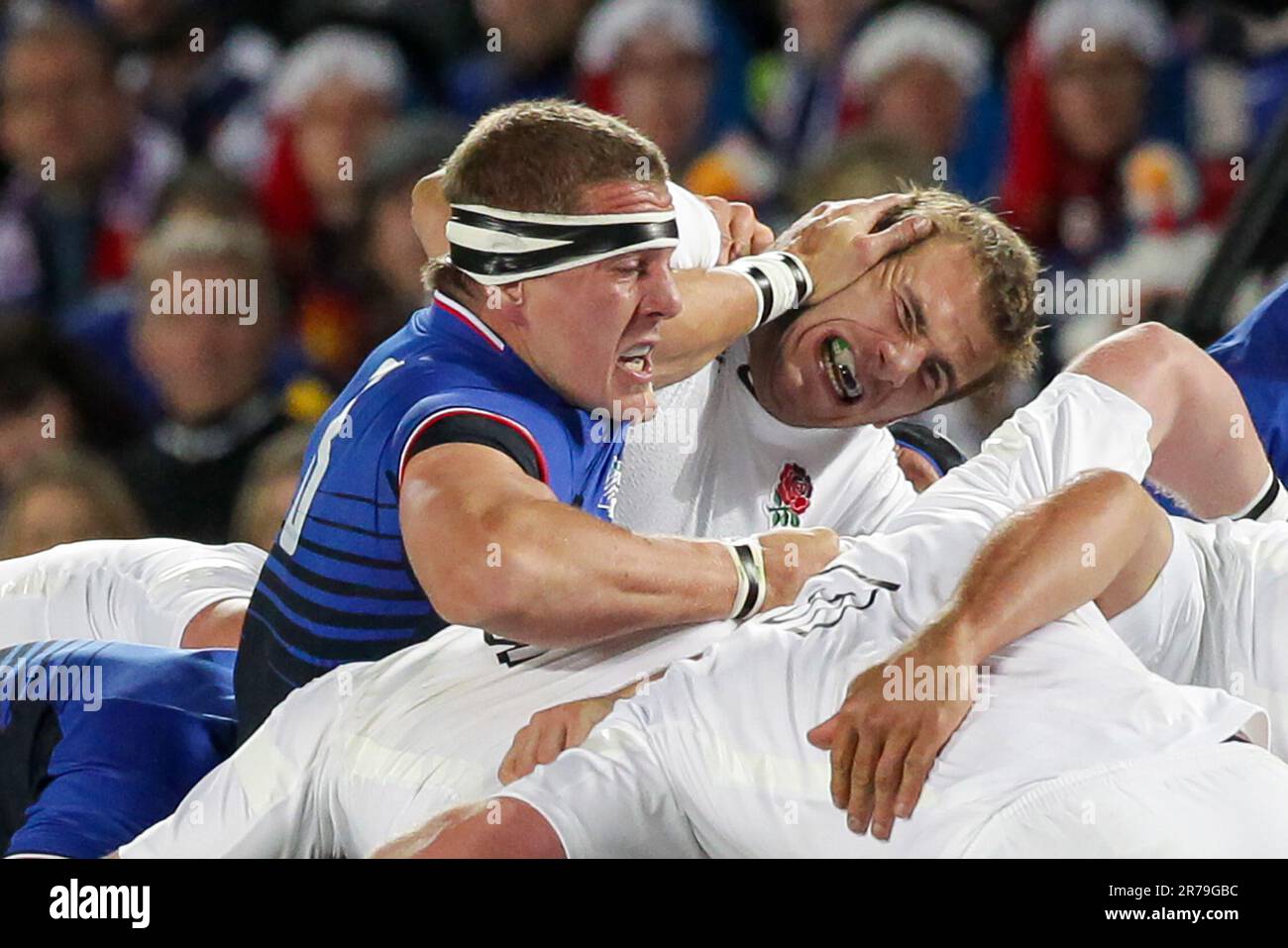 France’s Imanol Harinordoqul grabs the ear of England's Tom Croft ...