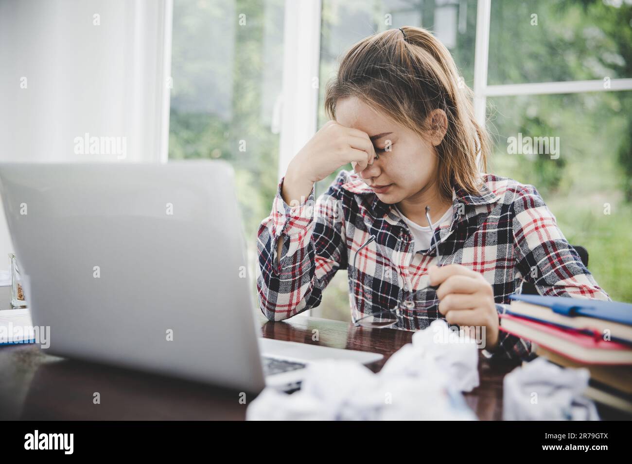 woman sitting down, his face unsettled. At the computer desk she has ...
