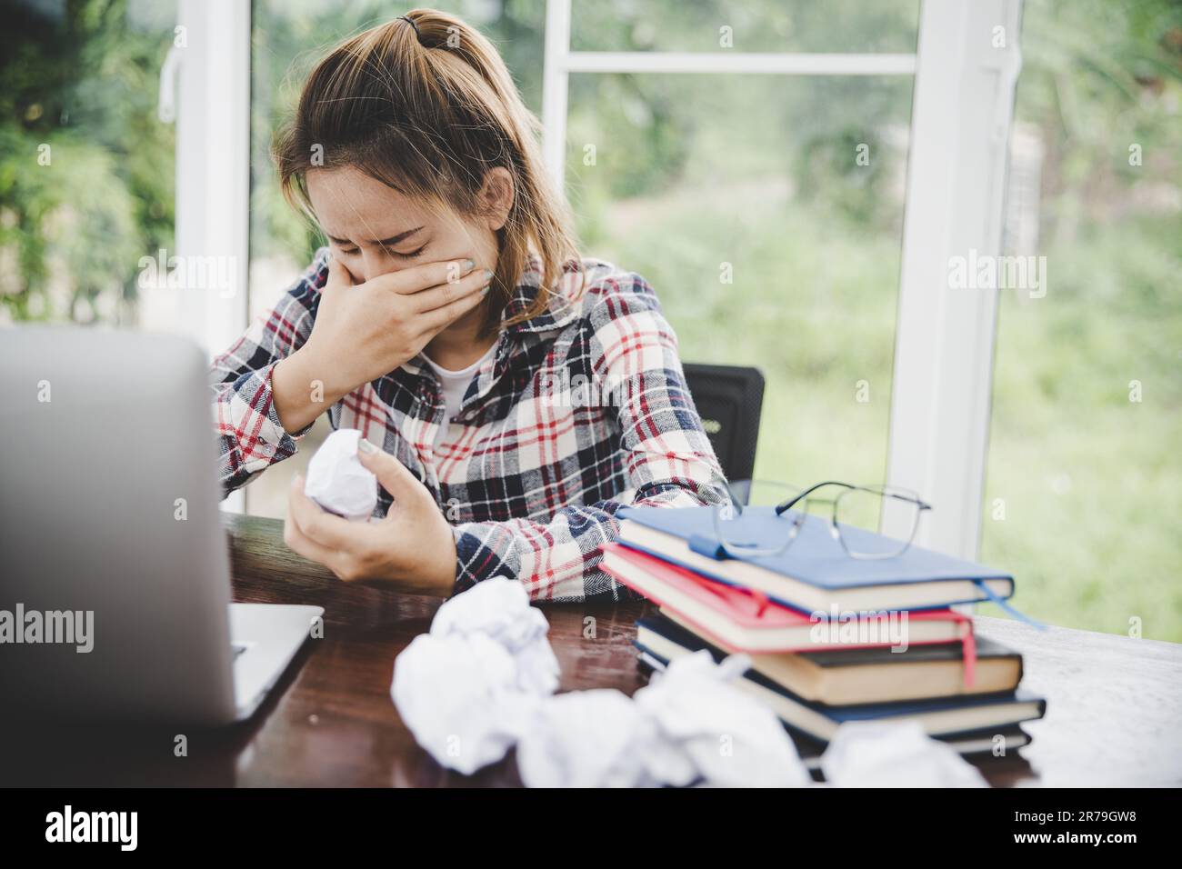 woman sitting down, his face unsettled. At the computer desk she has ...