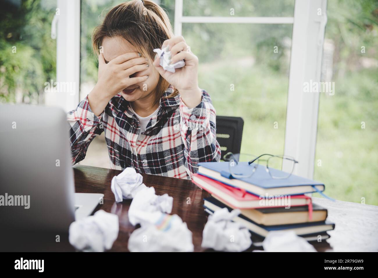 woman sitting down, his face unsettled. At the computer desk she has ...