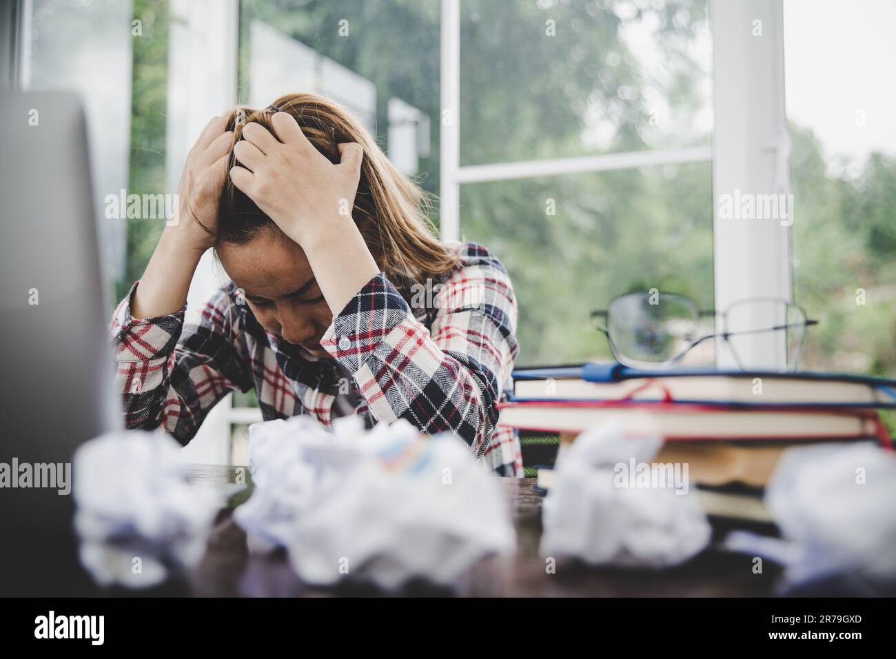 woman sitting down, his face unsettled. At the computer desk she has ...