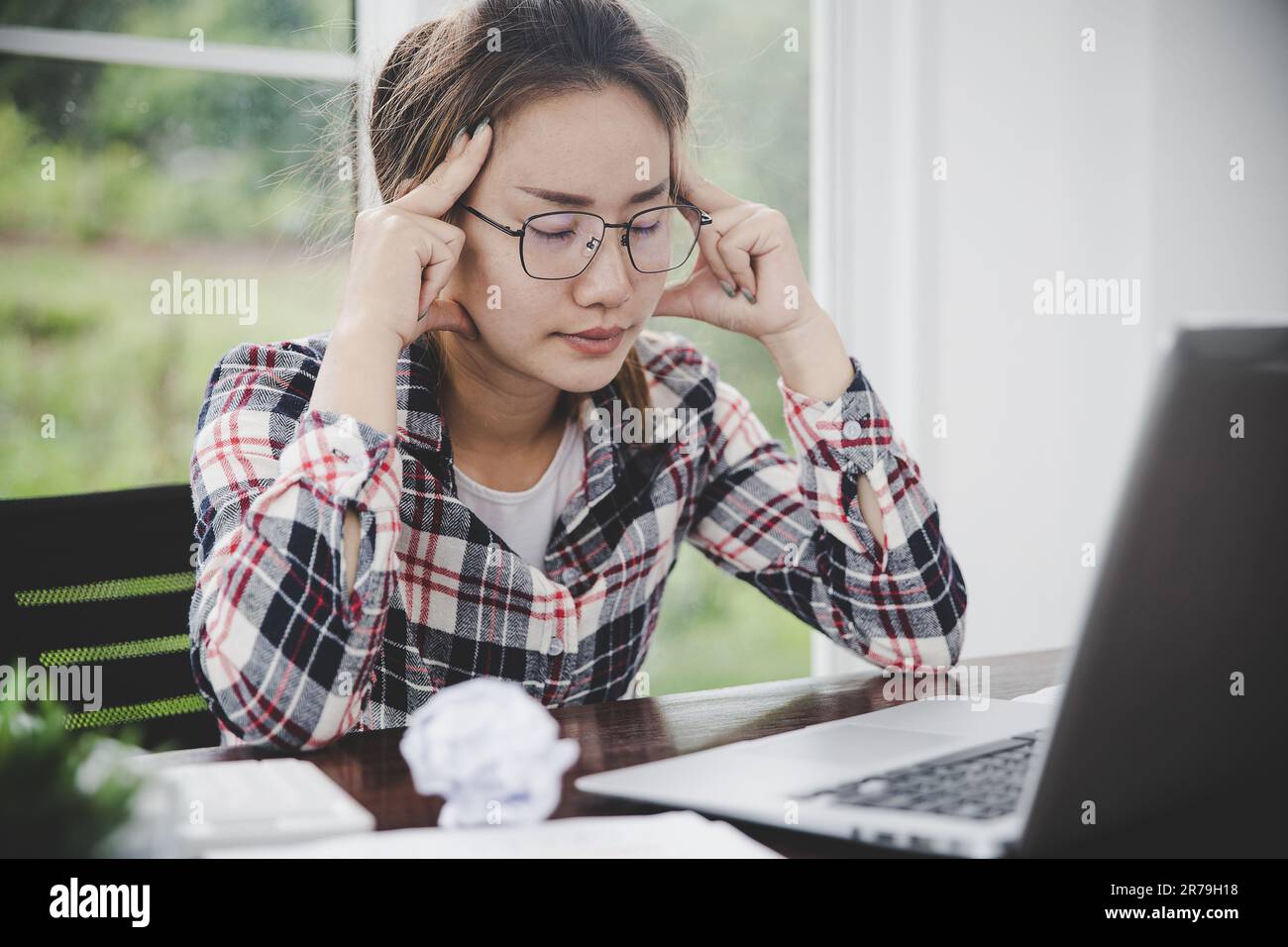 woman sitting down, his face unsettled. At the computer desk she has ...
