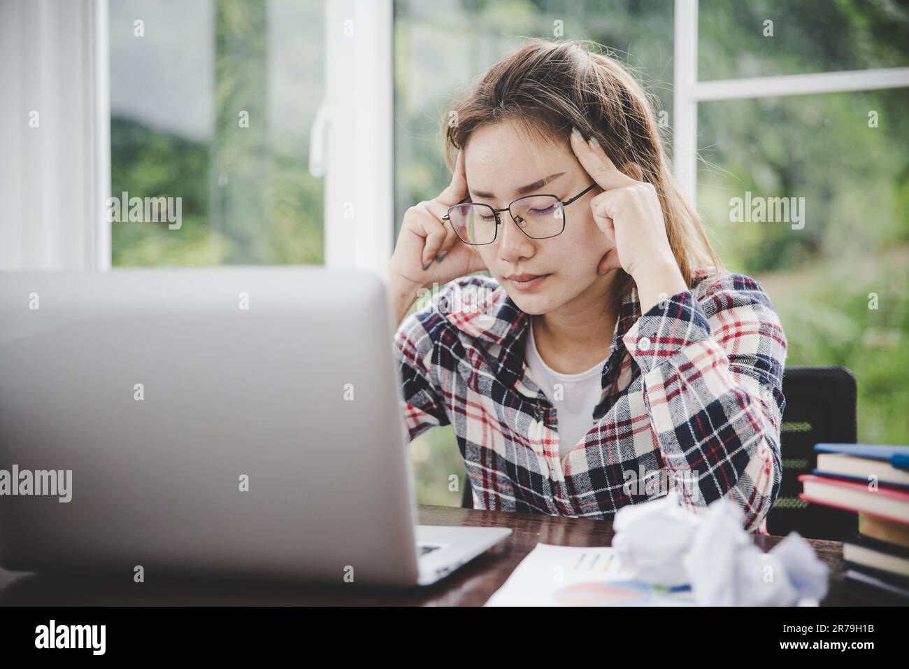 woman sitting down, his face unsettled. At the computer desk she has ...