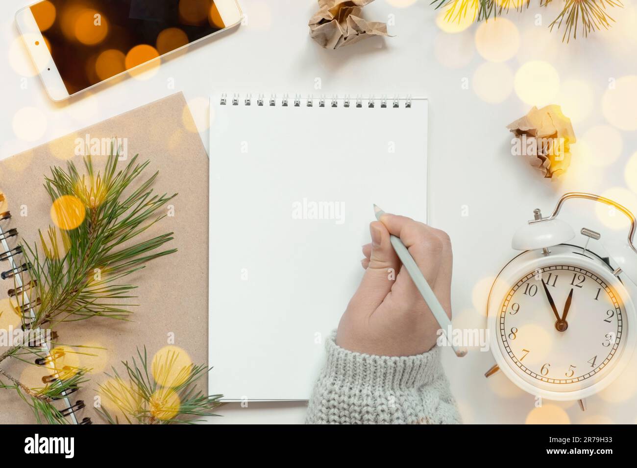 Back to life, goal list concept. Woman's hand writing in empty notebook ...