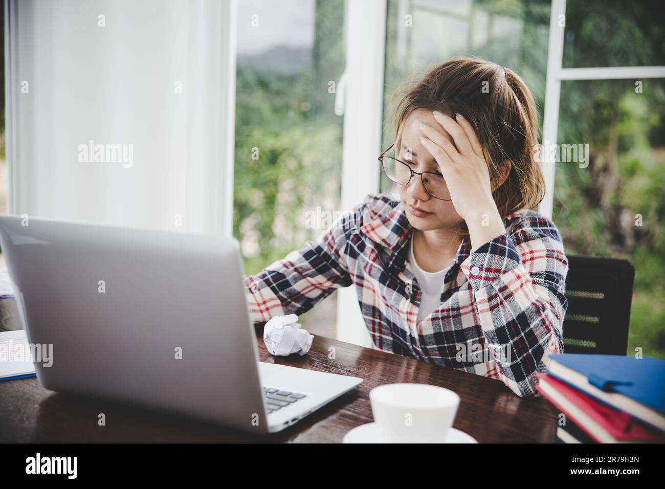 woman sitting down, his face unsettled. At the computer desk she has ...