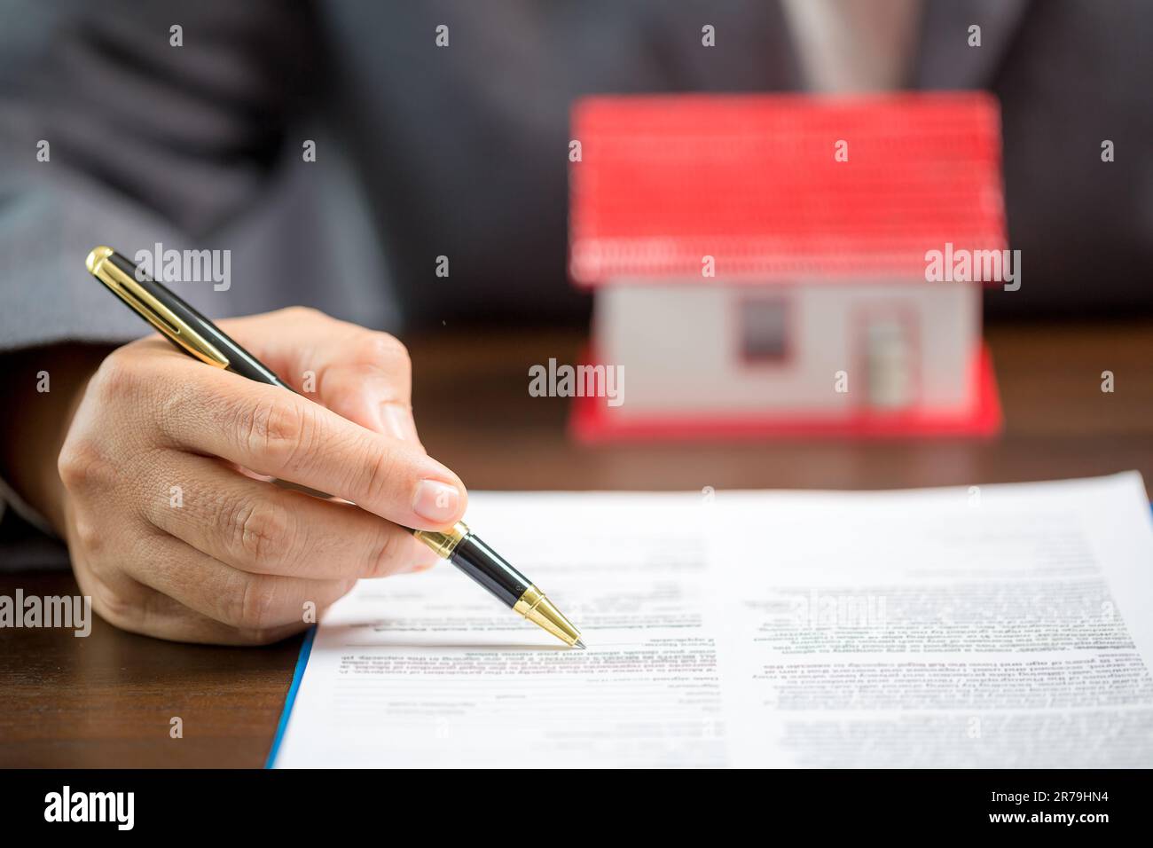 Woman home sales person is checking documents for house purchase ...