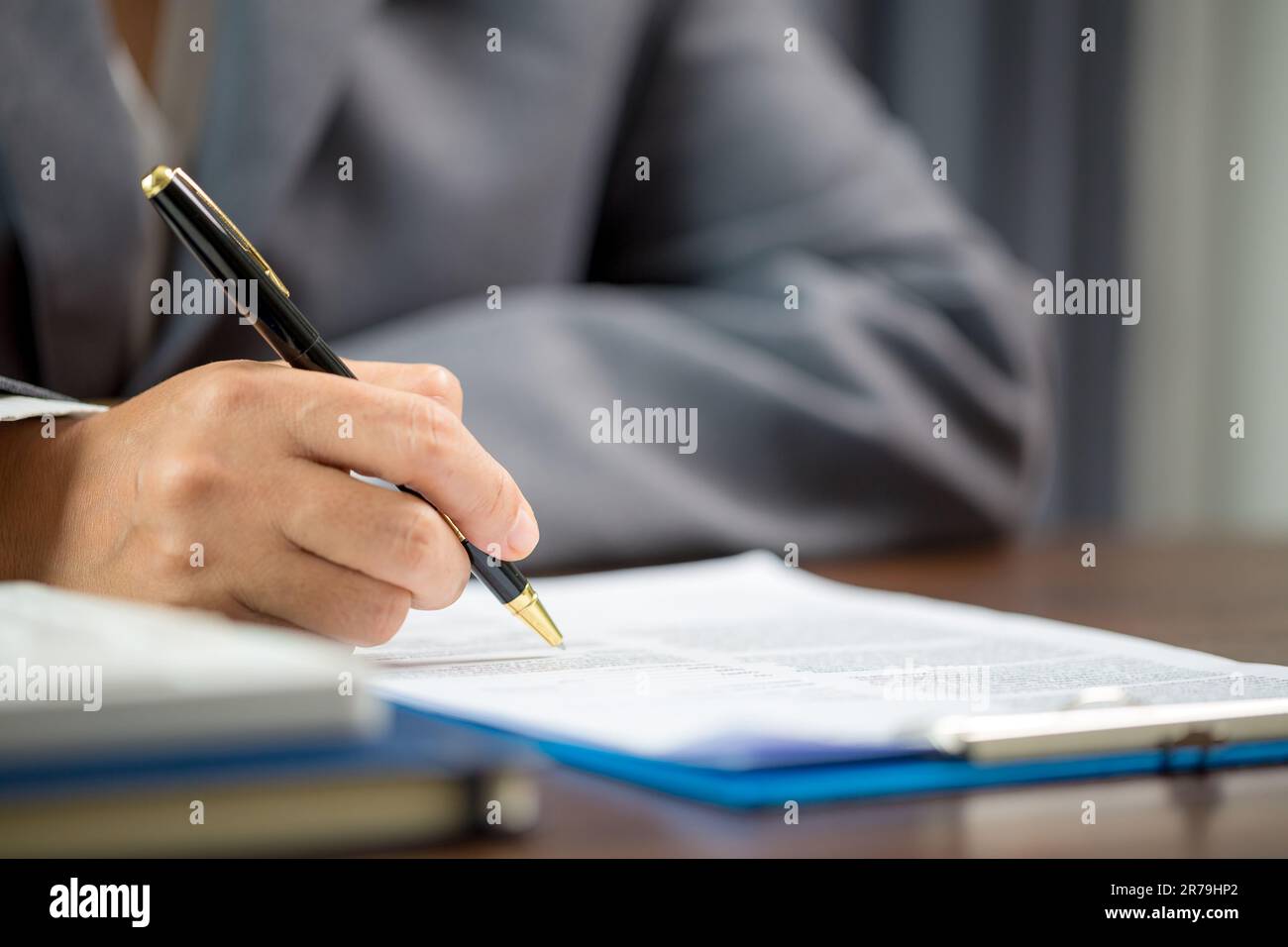 Woman home sales person is checking documents for house purchase ...