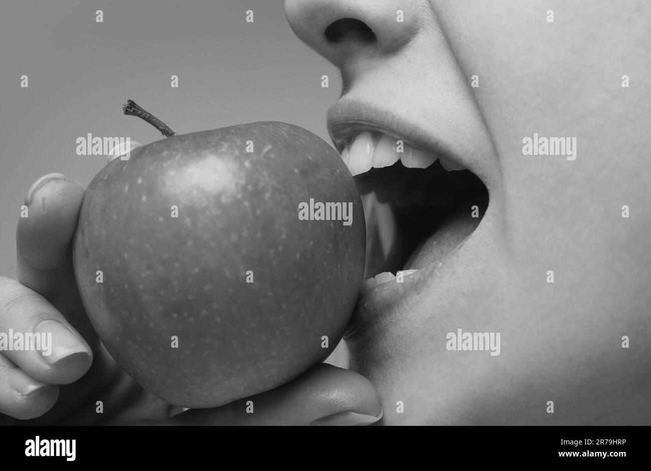 Woman eat apple teeth Black and White Stock Photos & Images - Alamy