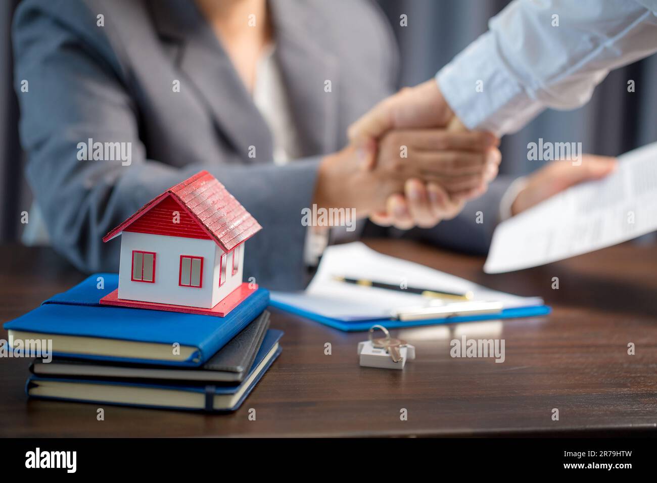 Woman home sales person is checking documents for house purchase ...