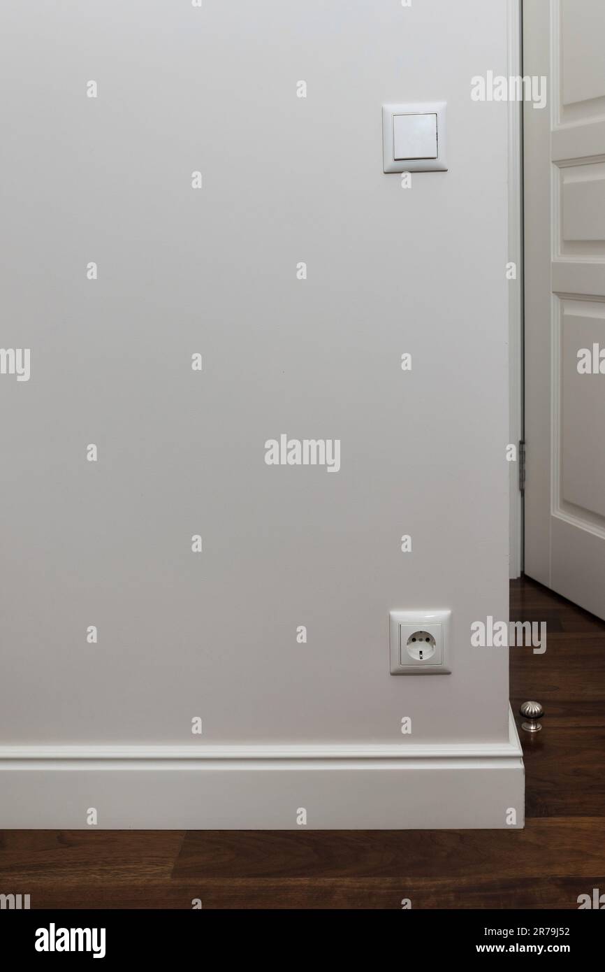 electric outlet in a wall in an new house interior Stock Photo - Alamy