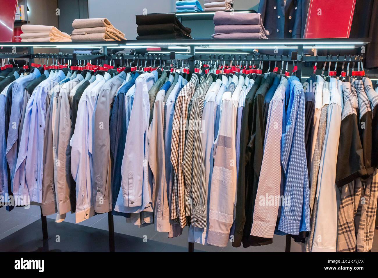 Clothing in the store. Rack with clothes in a shopping center Stock ...