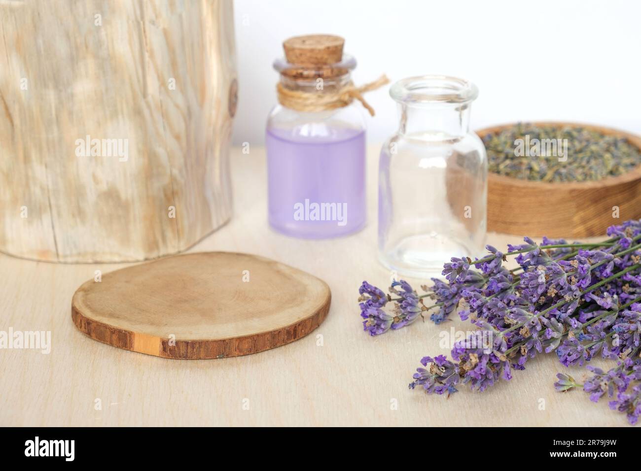 Podium for presentation on wooden table, lavender flowers. Abstract ...