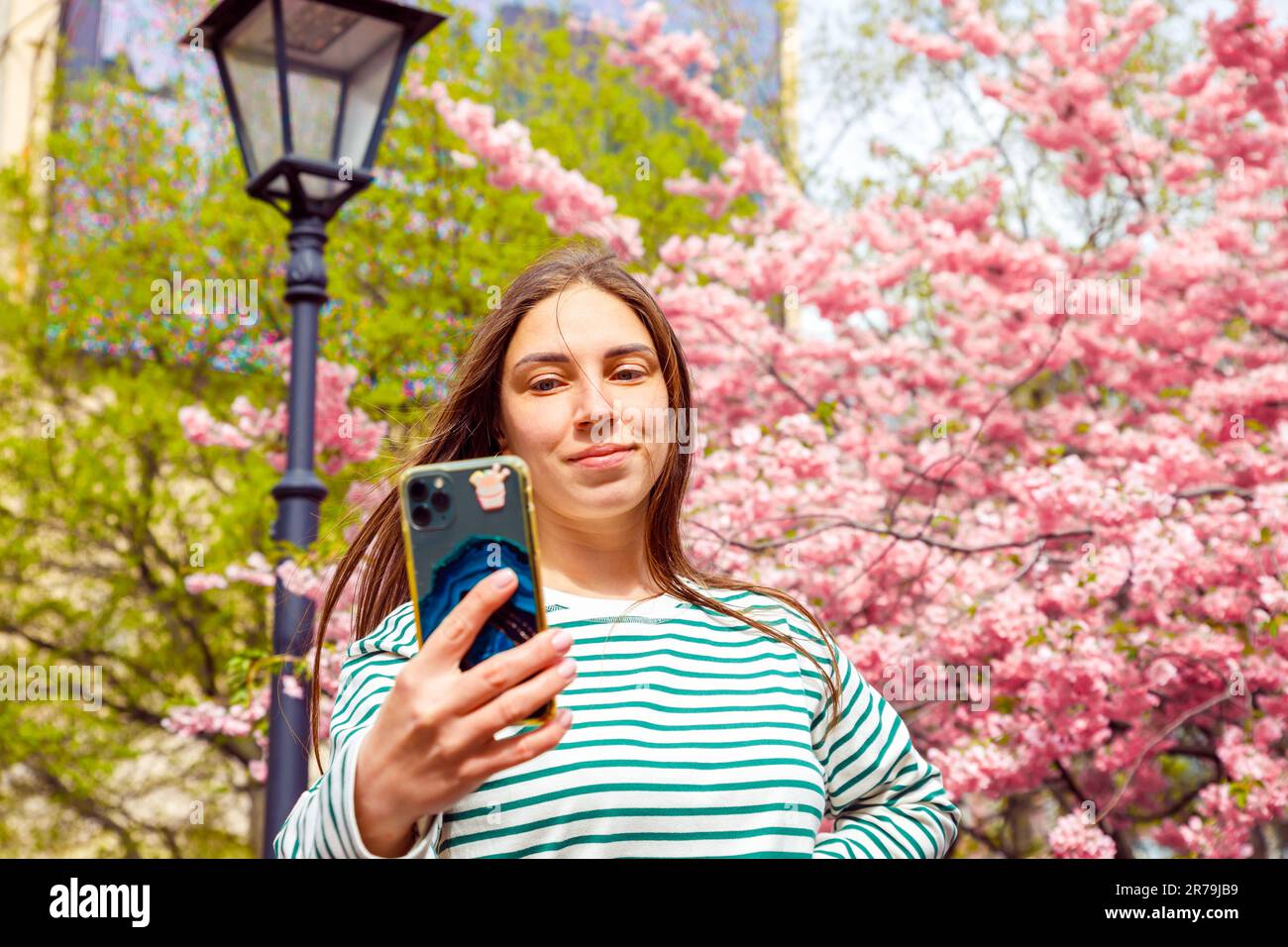 woman making video call, taking selfie portrait with mobile phone ...