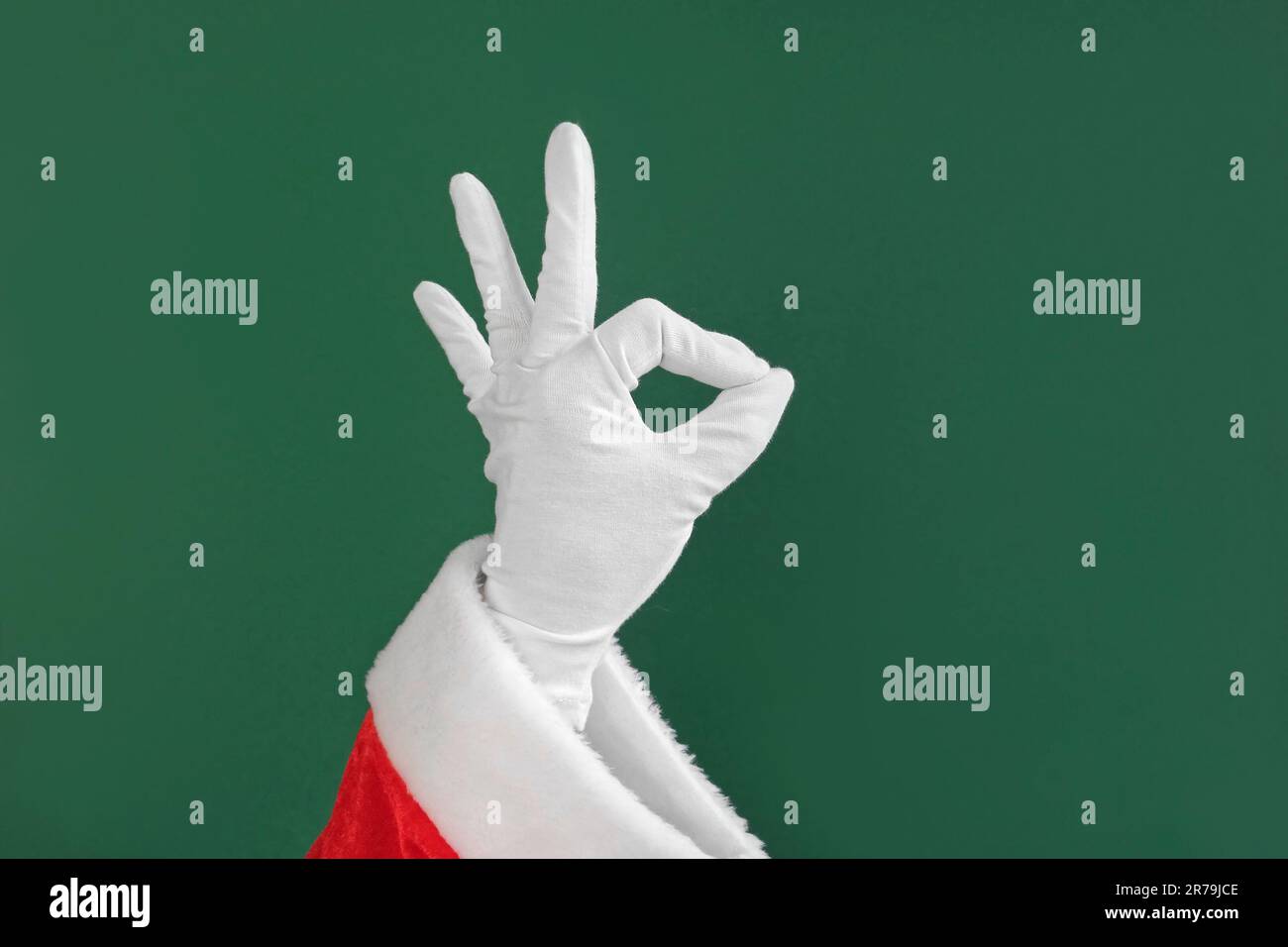 Santa Claus Hand Making Victory Sign and OK Gesture Isolated On Green ...