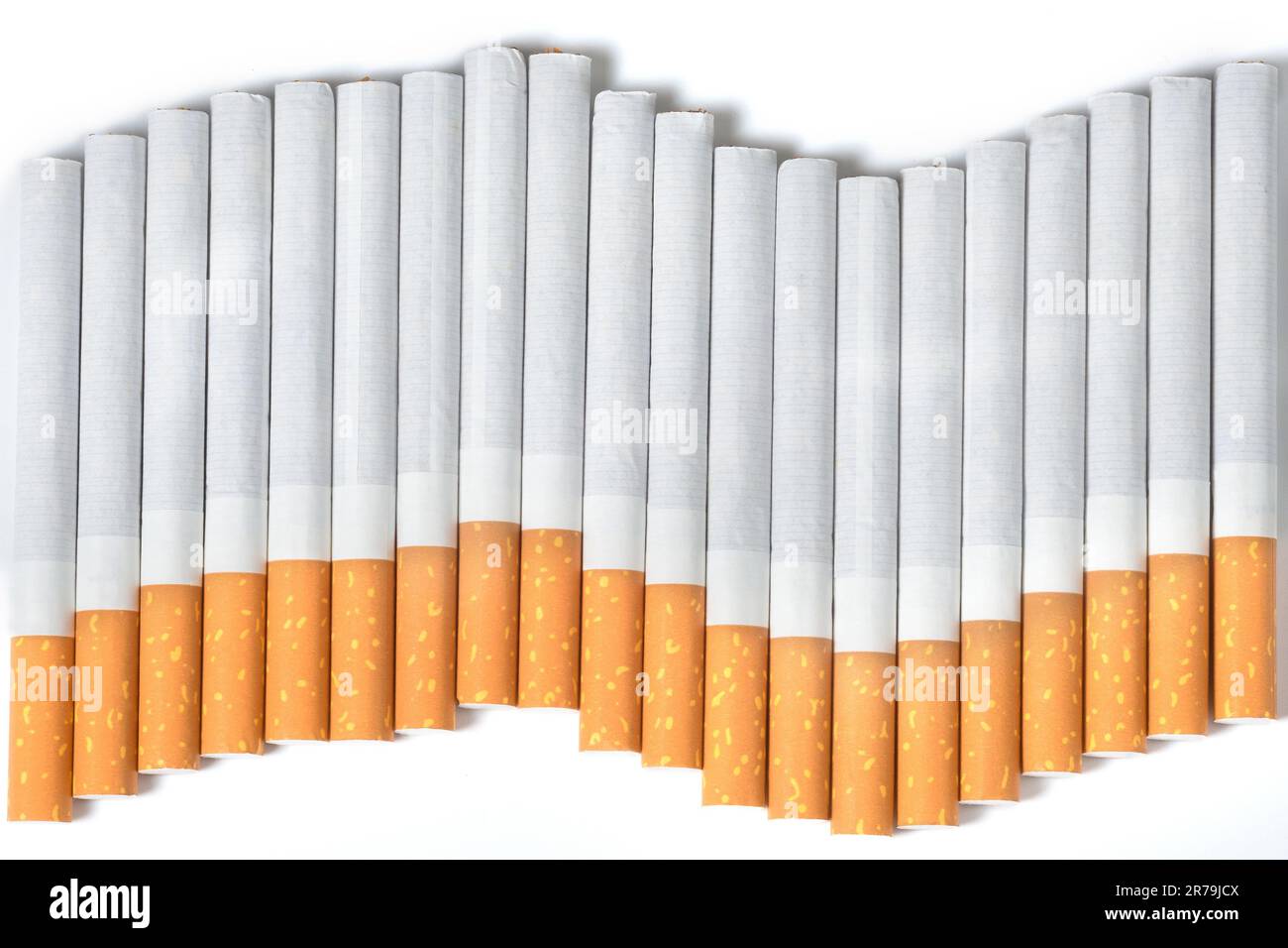 Cigarettes in the form of a wave at the white background. A view from ...