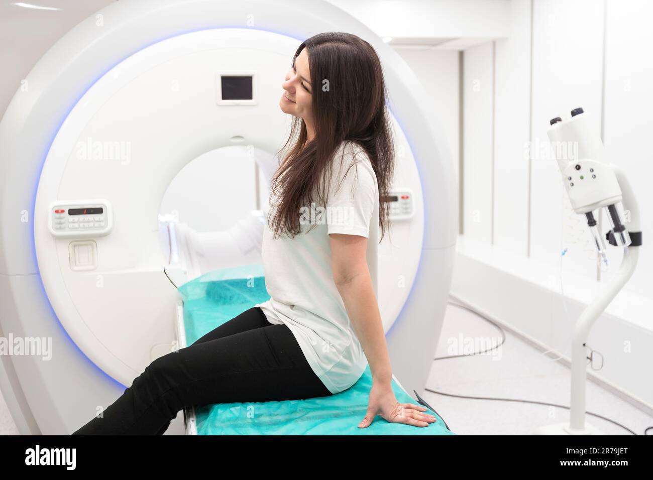 Female patient undergoing MRI - Magnetic resonance imaging in Hospital ...