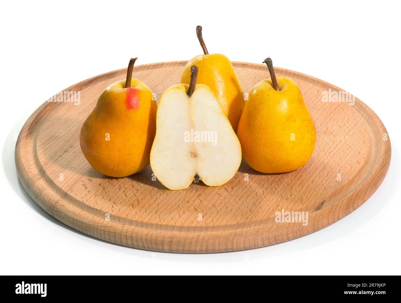 Yellow pears on a white background, three whole one sliced Stock Photo ...
