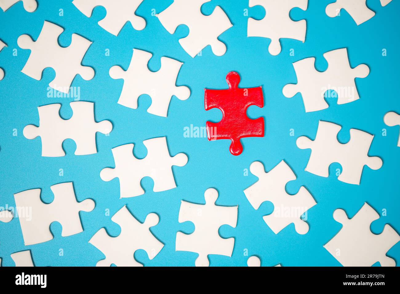 White part of jigsaw puzzle pieces on blue background. concepts of ...