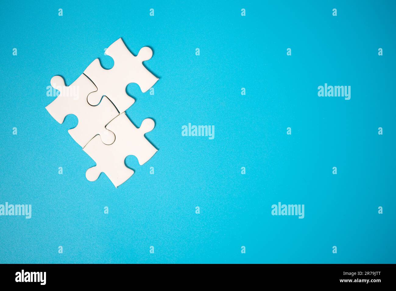 White part of jigsaw puzzle pieces on blue background. concepts of ...