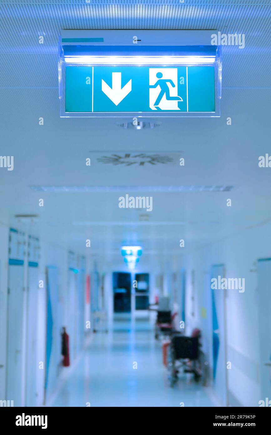 Empty hospital hallway. Exit sign. Medical healthcare concept Stock ...