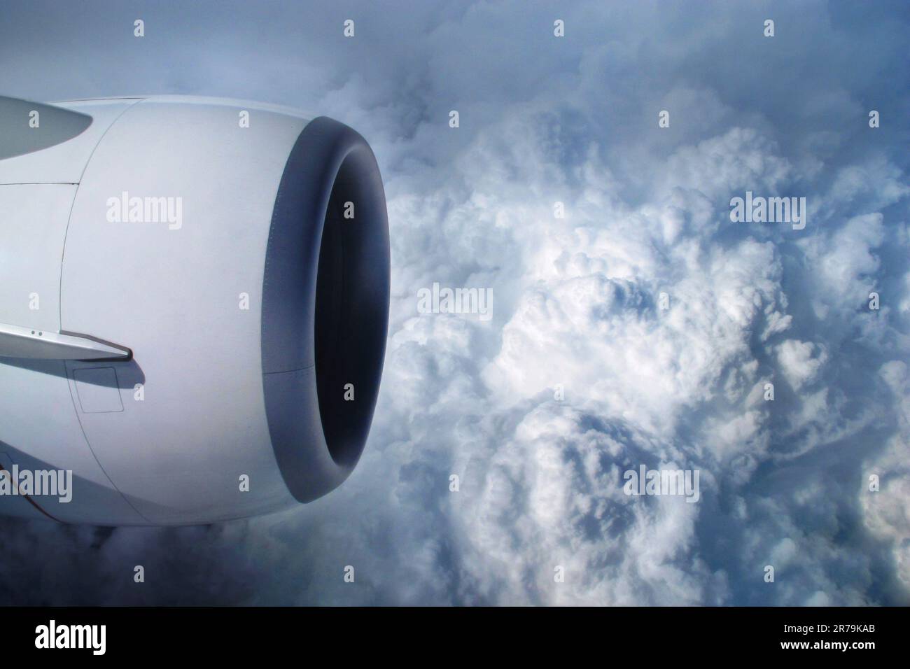View of the sky and clouds from the airplane porthole. jet engine ...