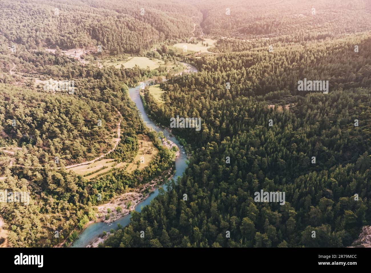 Aerial view of azure blue winding river in deep canyon surrounded by ...