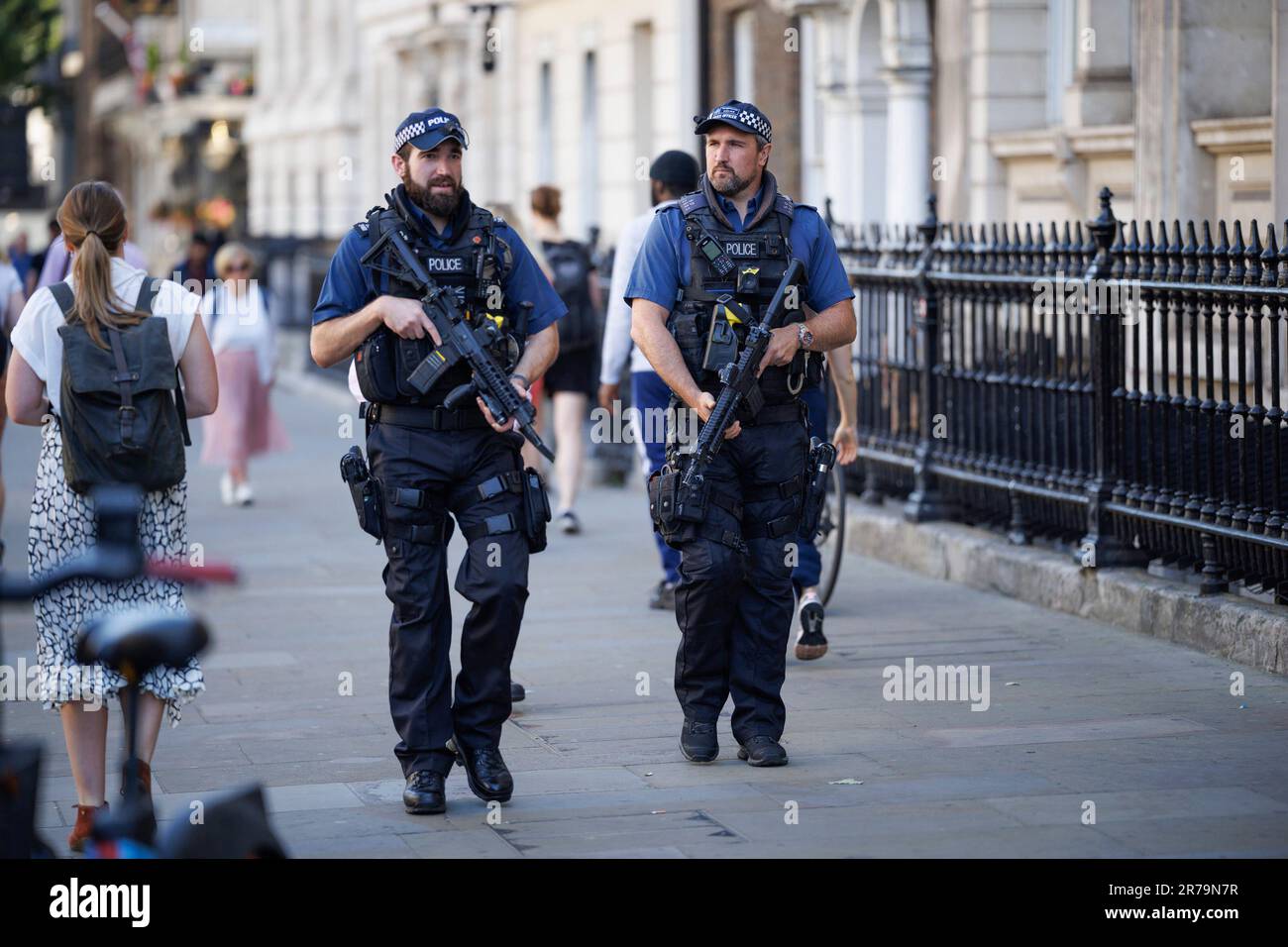 London, UK. 14th June, 2023. Armed police officers patrol along ...